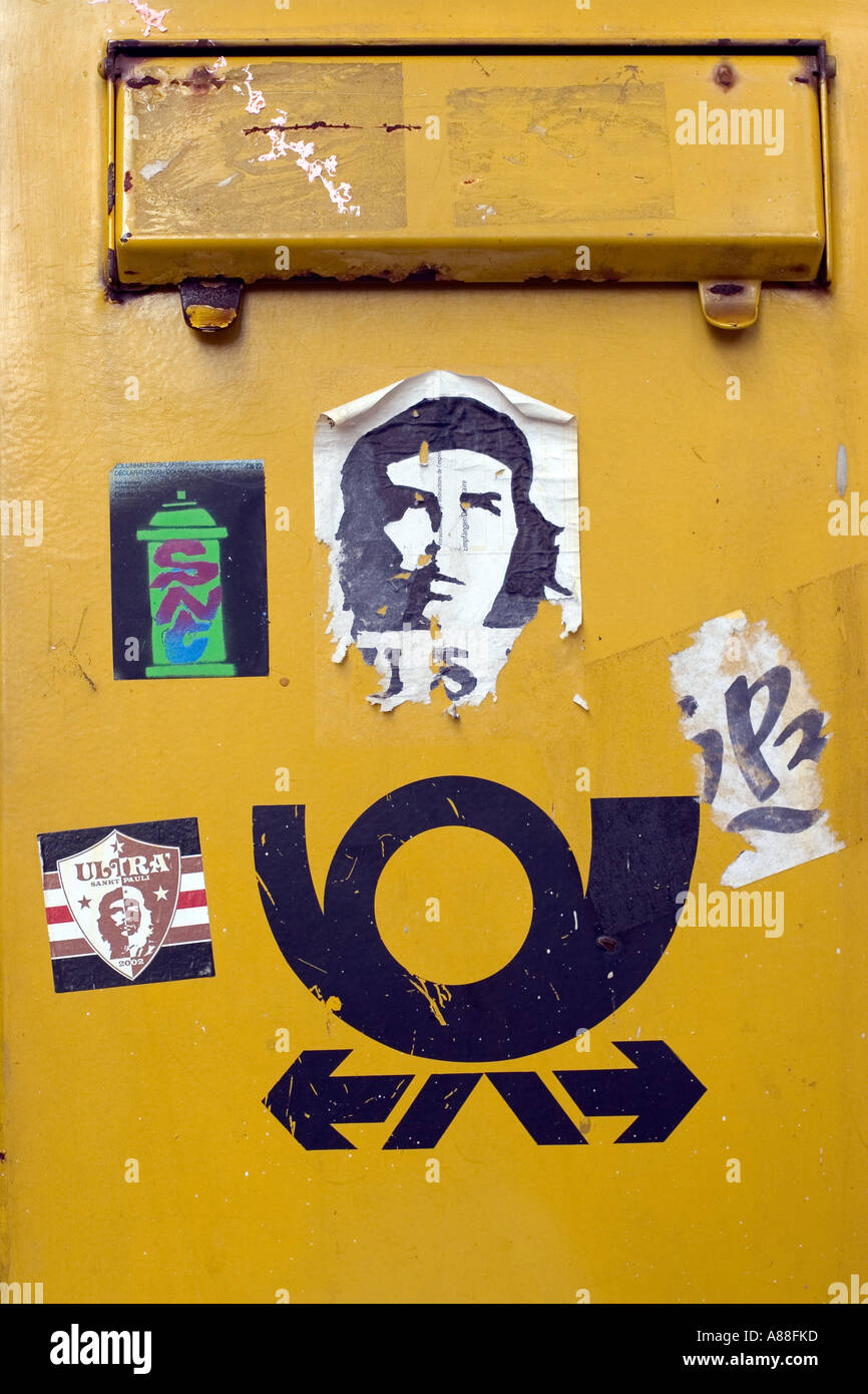 Yellow post box of Deutsche Post with Ernesto Che Guevara and other ...