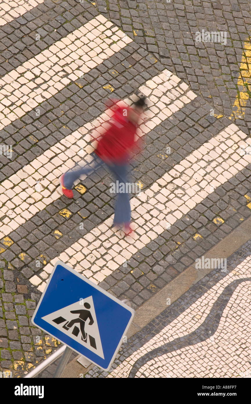 a woman crossing a Zebra crossing in Aveiro, Portugal Stock Photo - Alamy