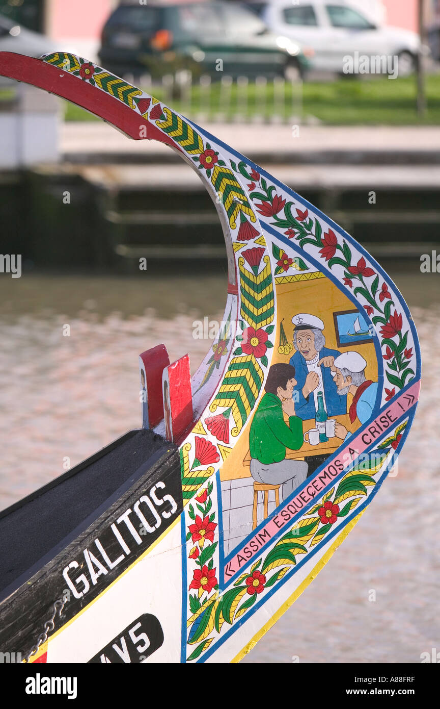 hand painted designs on traditional Moliceiro fishing boats on a canal ...