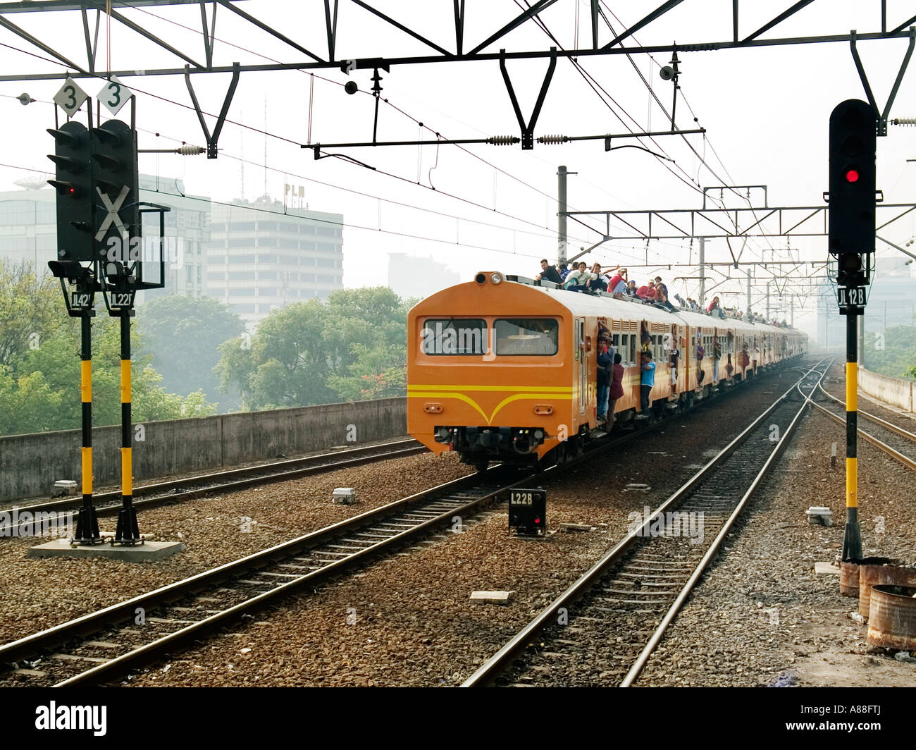 commuters pack a local train including the roof rush hour jakarta ...