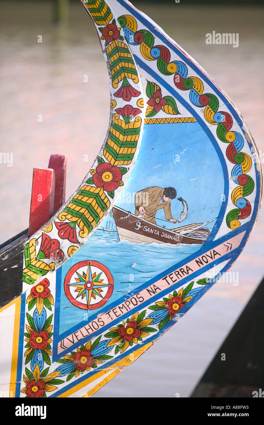 hand painted designs on traditional Moliceiro fishing boats on a canal ...