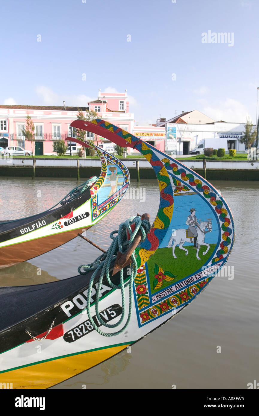a traditional Moliceiro fishing boat on a canal in aveiro, portugal ...