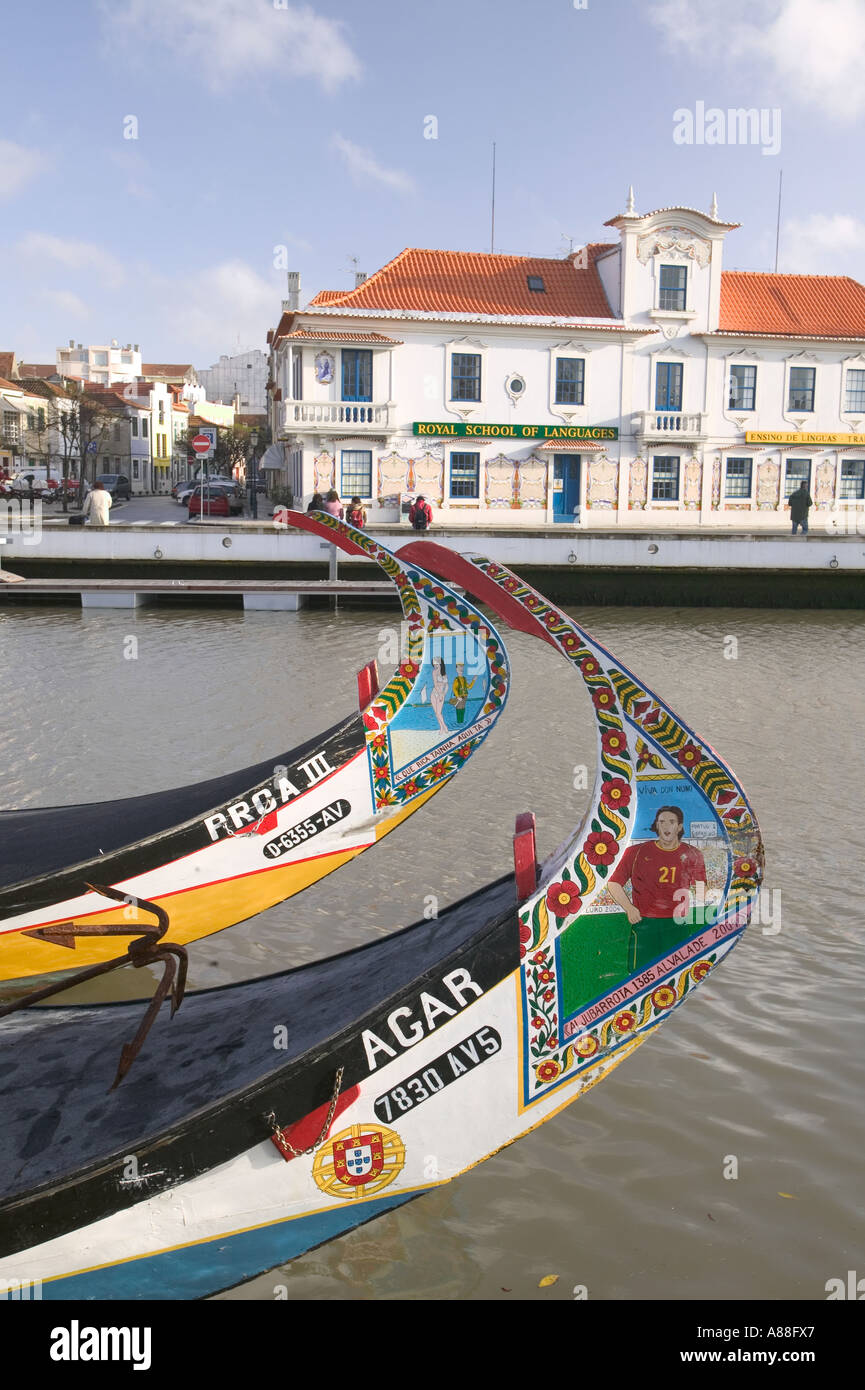 a traditional Moliceiro fishing boat on a canal in aveiro, portugal ...