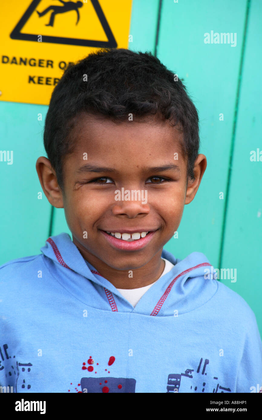 Striking vertical portrait of cute young afro caribbean boy smiling by ...