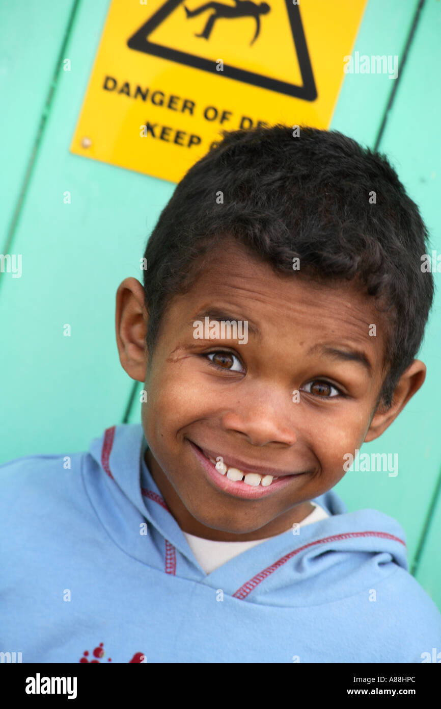 Striking vertical portrait of young afro caribbean boy with attitude ...