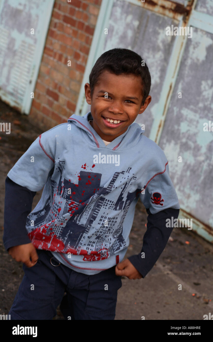 Vertical three quarter length portrait of cute afro caribbean boy ...