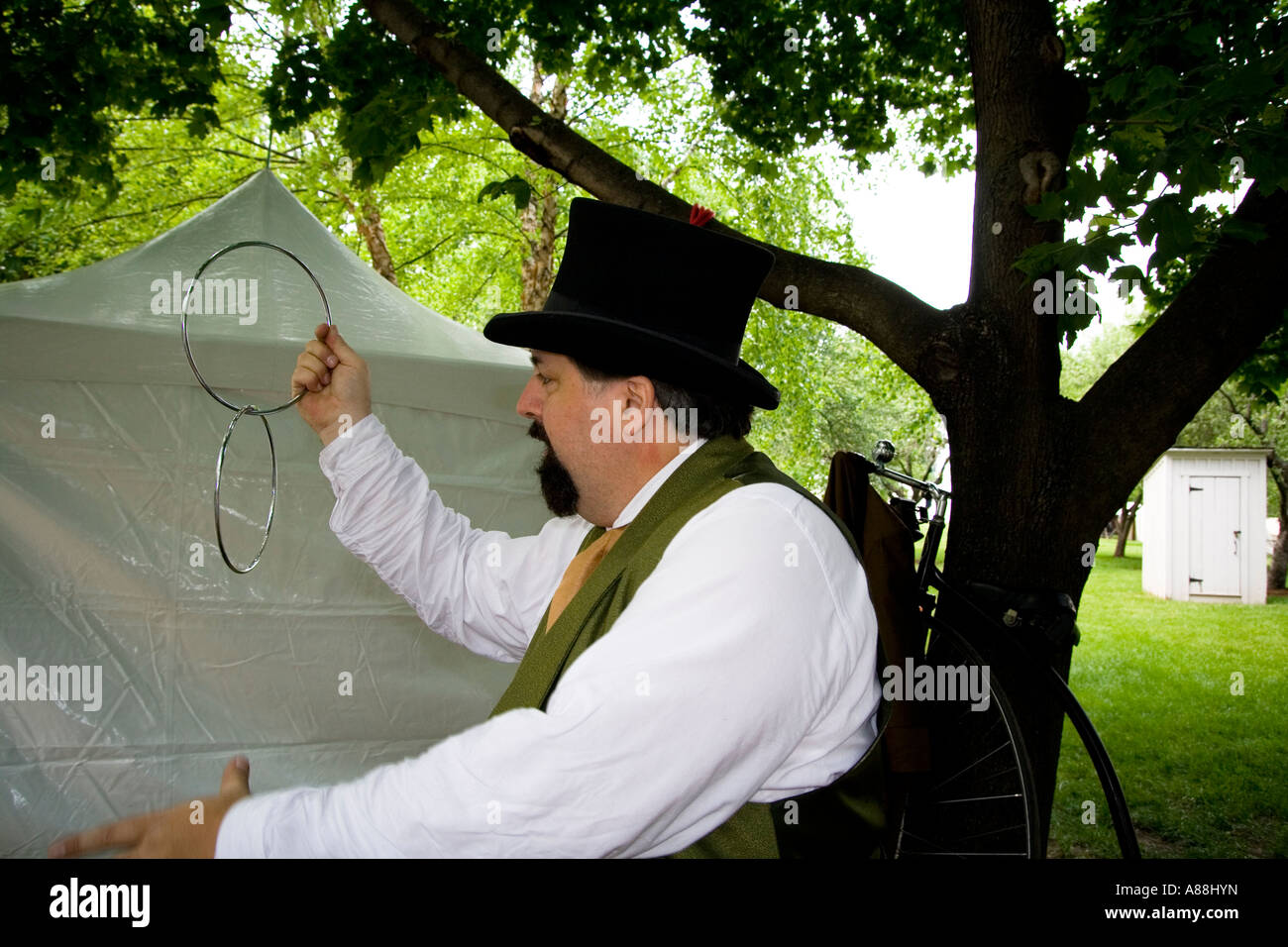 magician performing a magic trick Stock Photo - Alamy