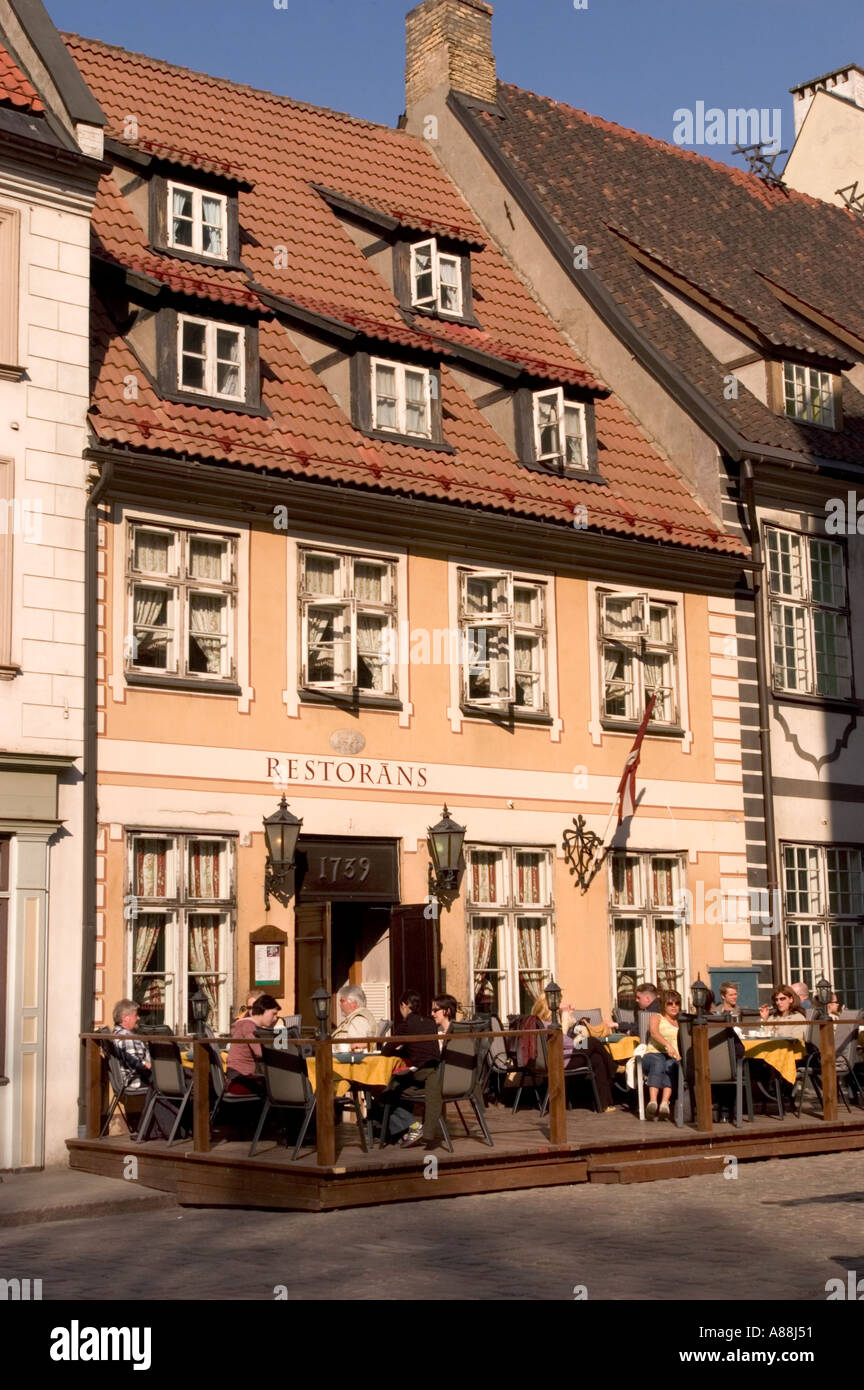 Tourist sitting behind 1739 Restaurant situated Located in a historic ...