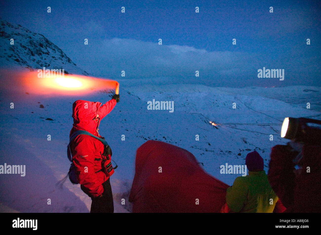 a mountain rescue team perform a night rescue in Winter, Red Screes ...