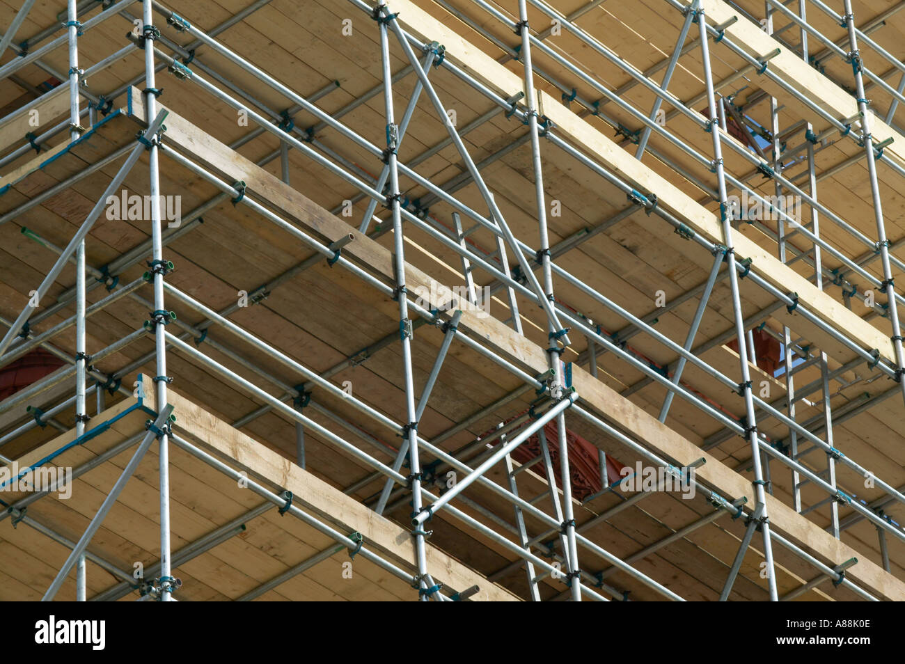 Scaffolding around an old building in the process of being renovated ...