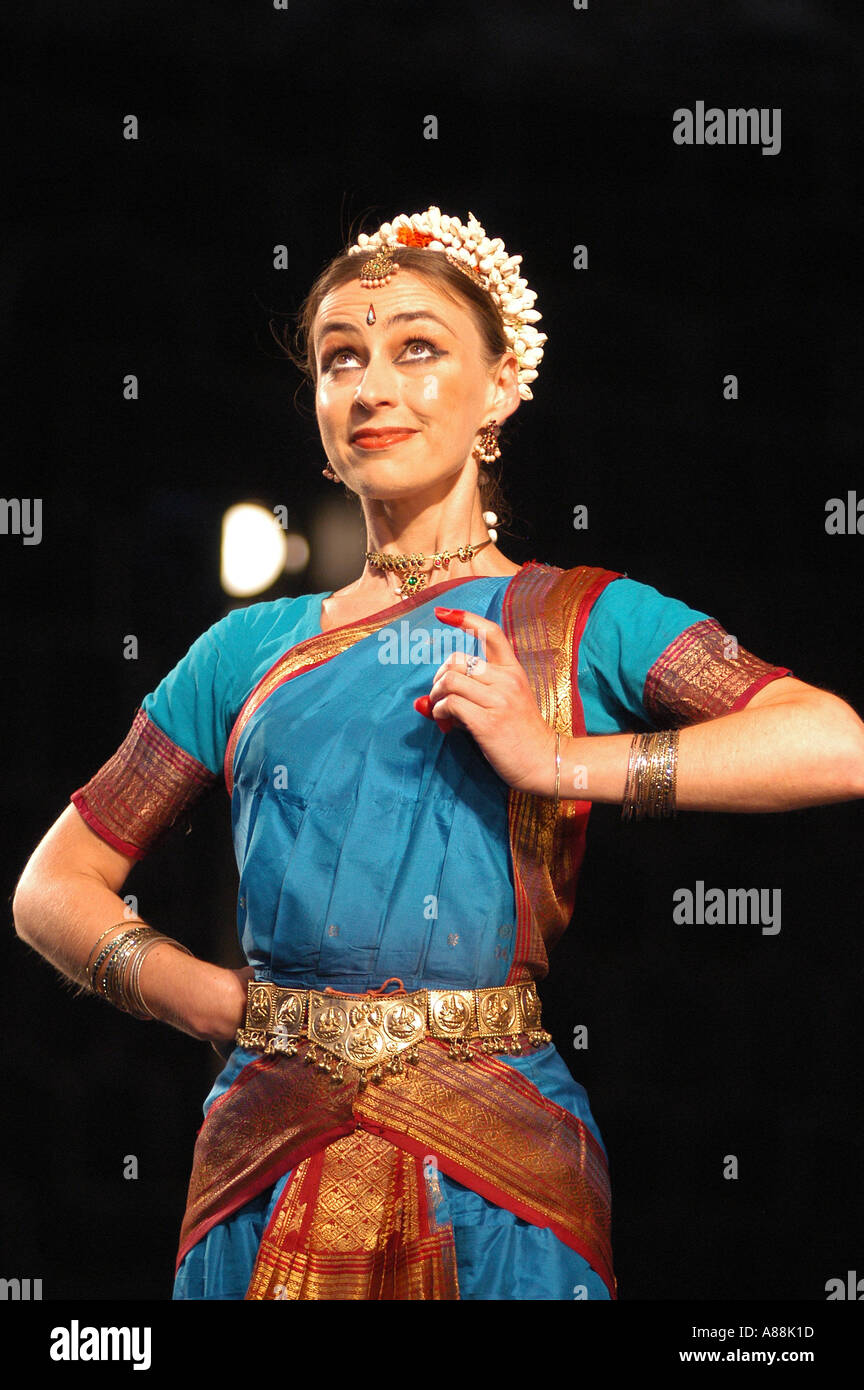 European female dancer performing traditional Indian dance on stage ...