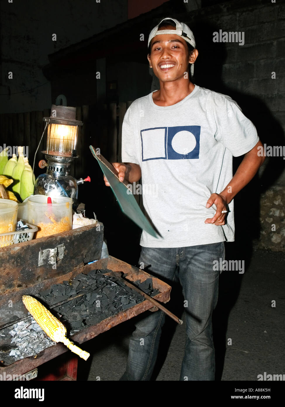 Happy man selling corn on hi-res stock photography and images - Alamy