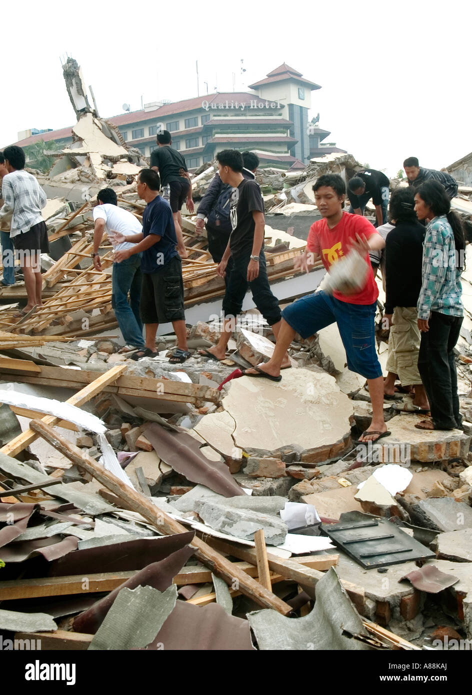 local people dig through the rubble after the may 2006 earthquake ...