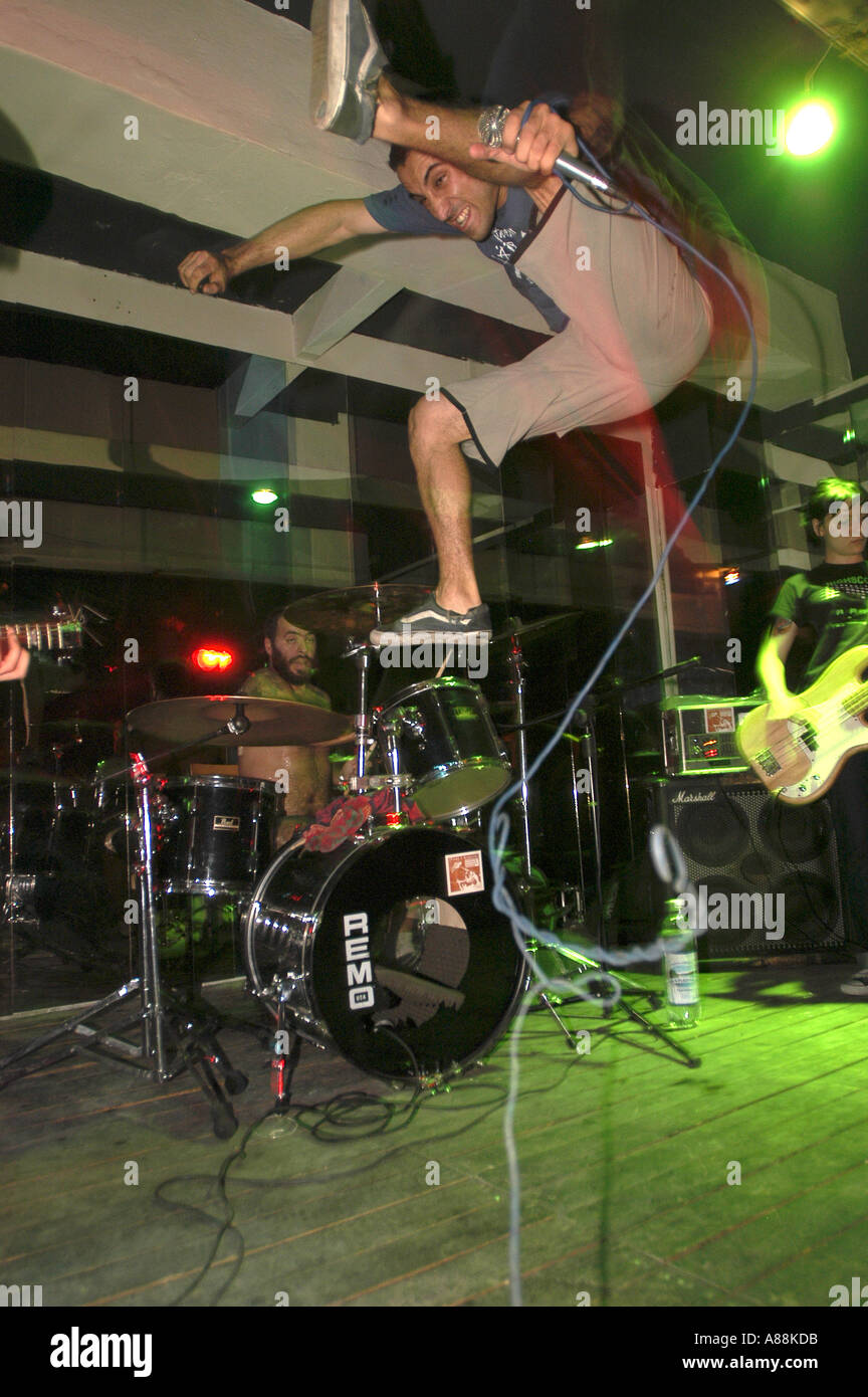 Hard core band concert vocalist jumping Stock Photo - Alamy