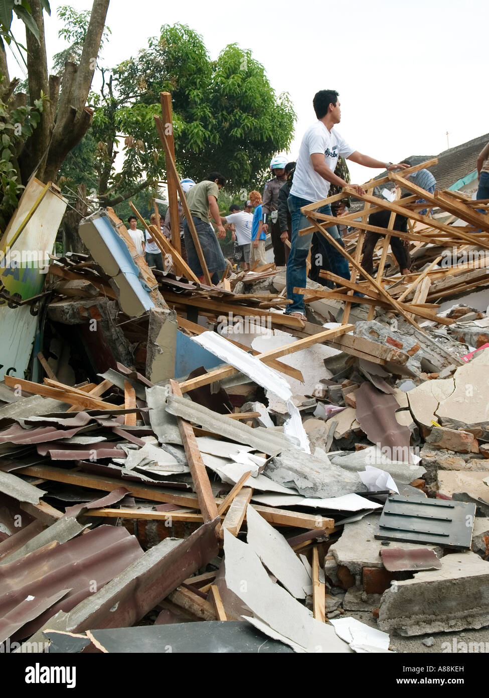 local people dig through the rubble after the may 2006 earthquake ...