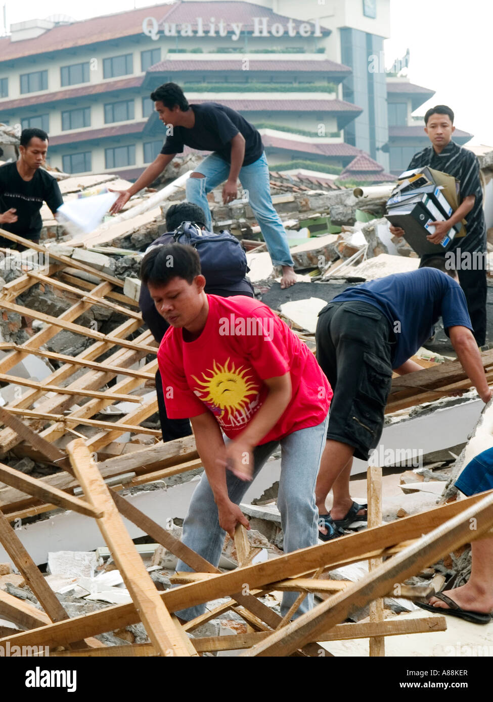 Local people dig into the rubble of collapsed buildings minutes after ...