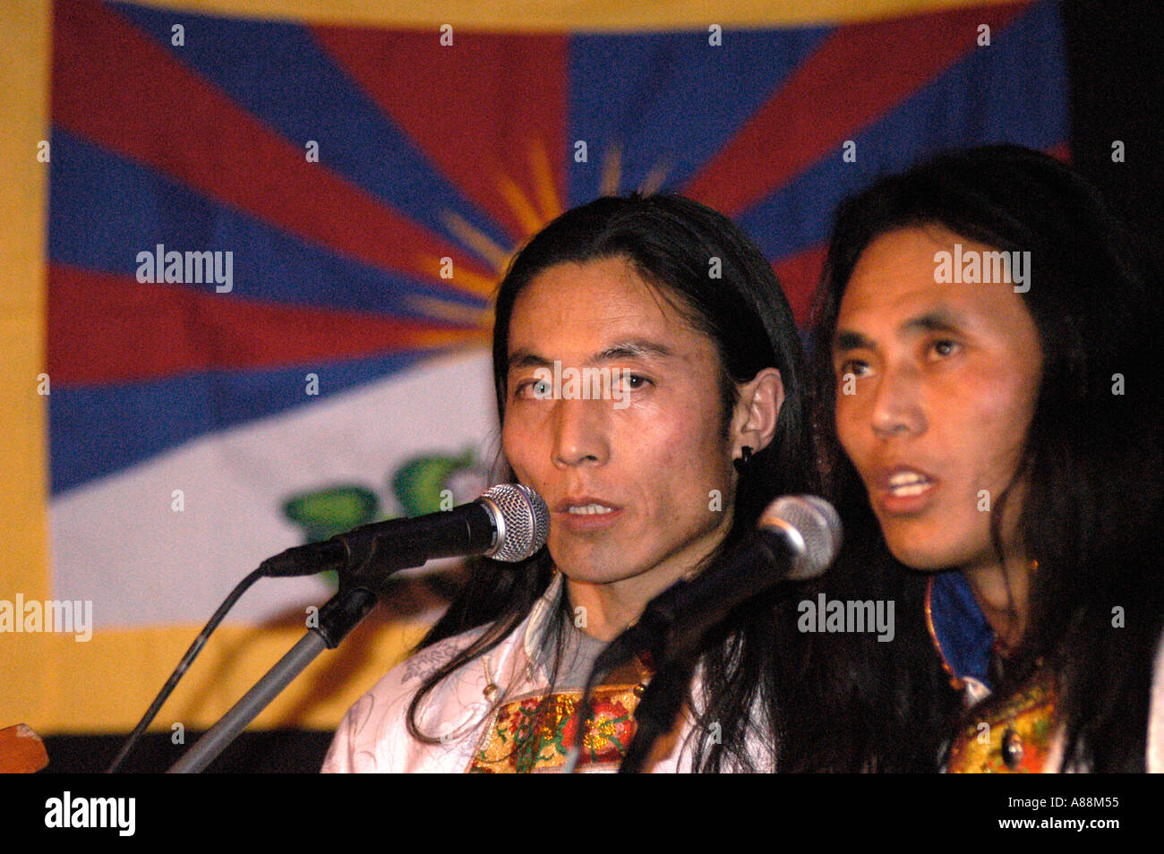 Tibetan singers from Snow Lion music band singing with Tibet flag in ...