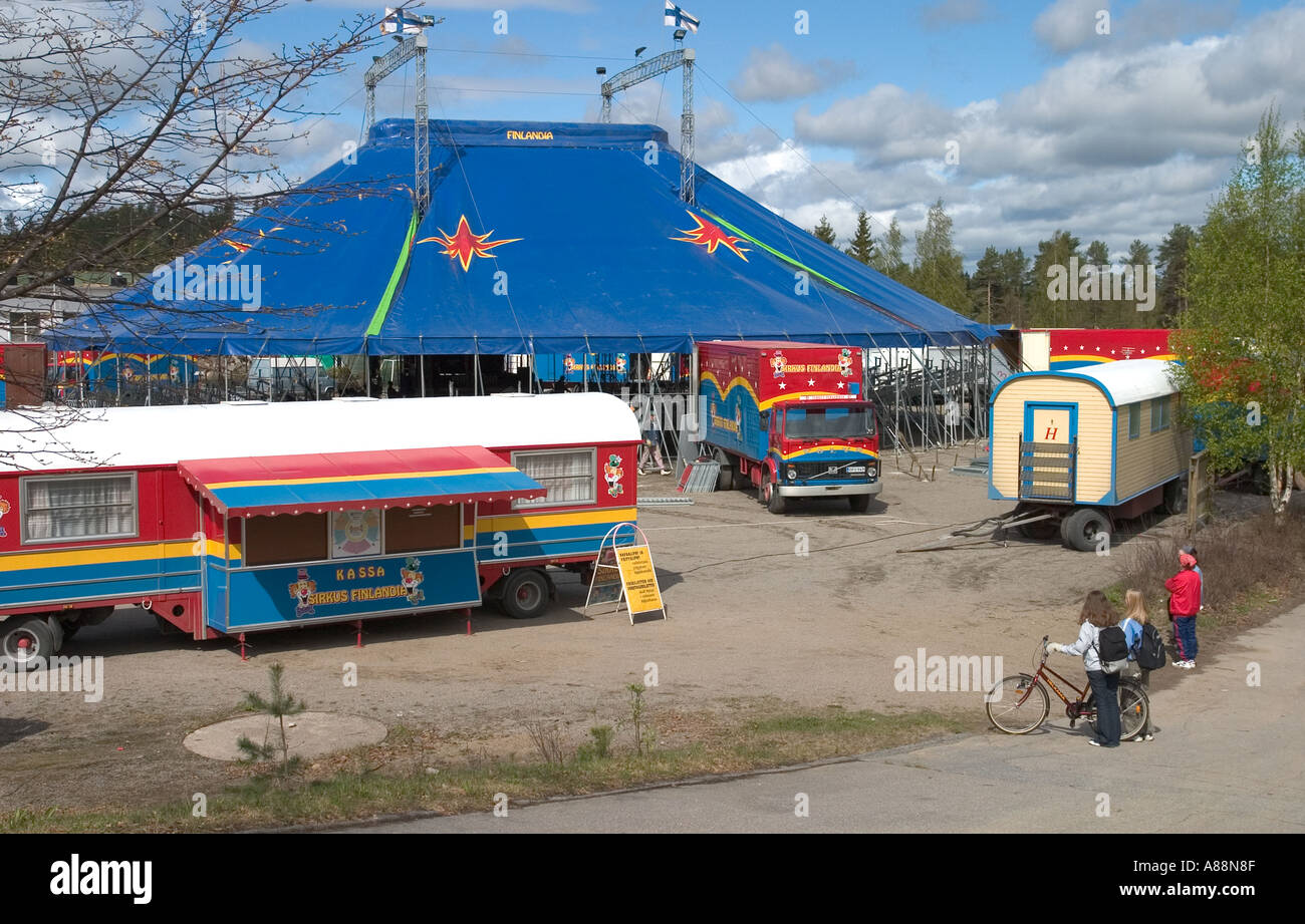 Children watching the setting up of a circus arena for traveling circus ...