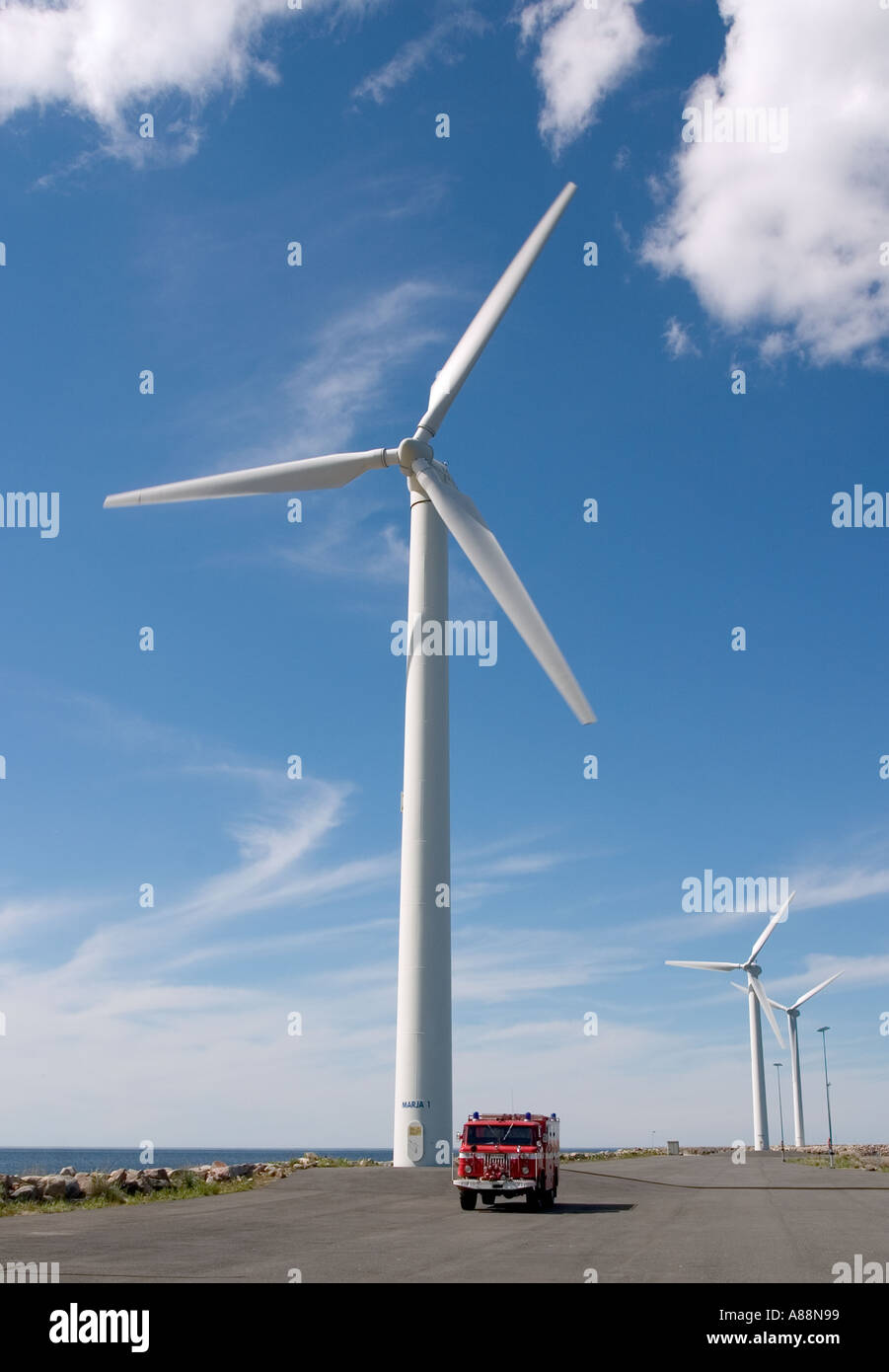 Red fire engine under wind power plant , Finland Stock Photo - Alamy