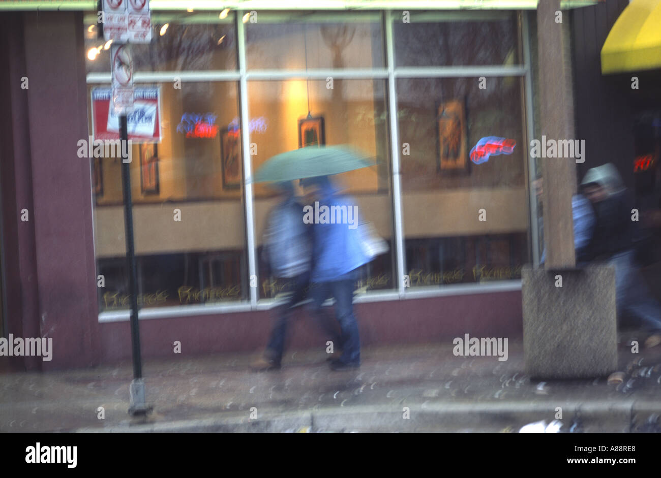 Shopper in the rain Stock Photo - Alamy