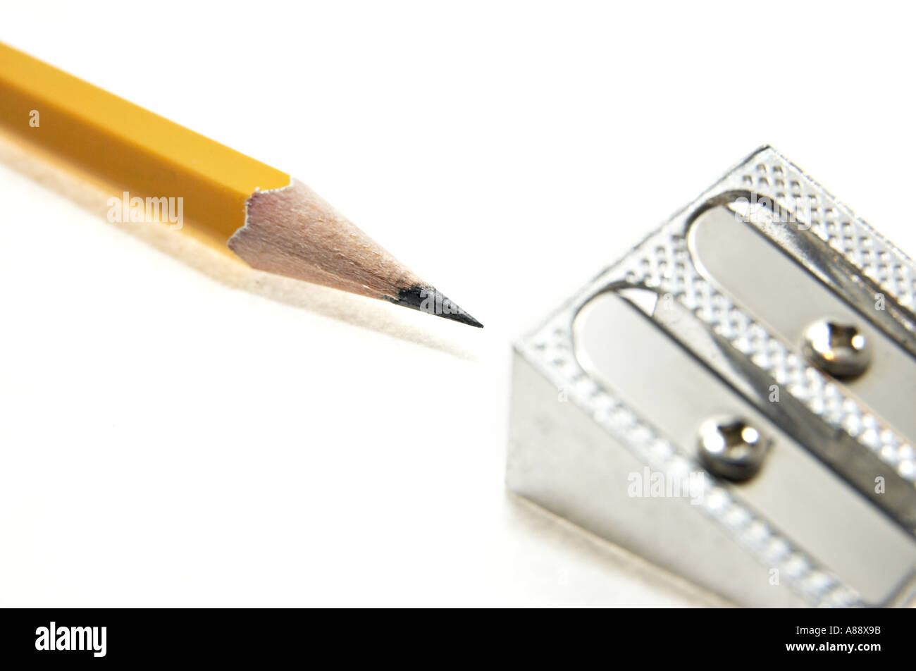Pencil and sharpener with shavings Stock Photo - Alamy