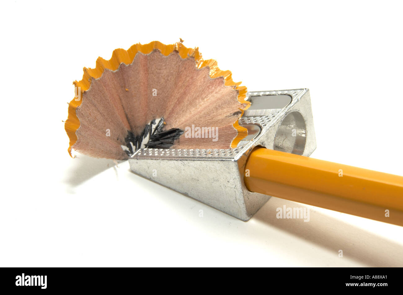 Pencil and sharpener with shavings Stock Photo - Alamy