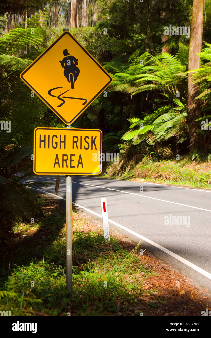 Motorcycle warning sign on forest road Stock Photo - Alamy