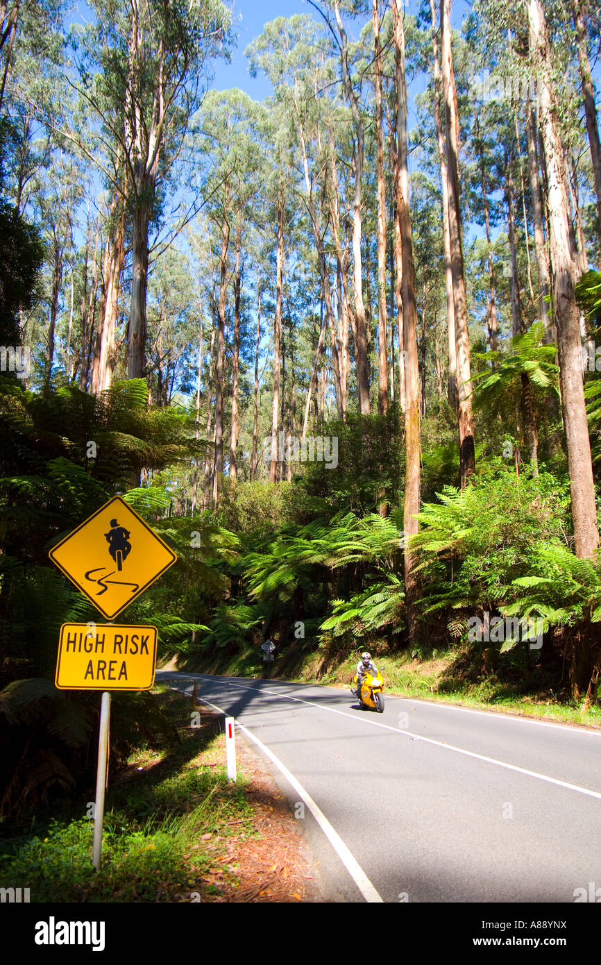 Motorcycle warning sign on forest road Stock Photo - Alamy