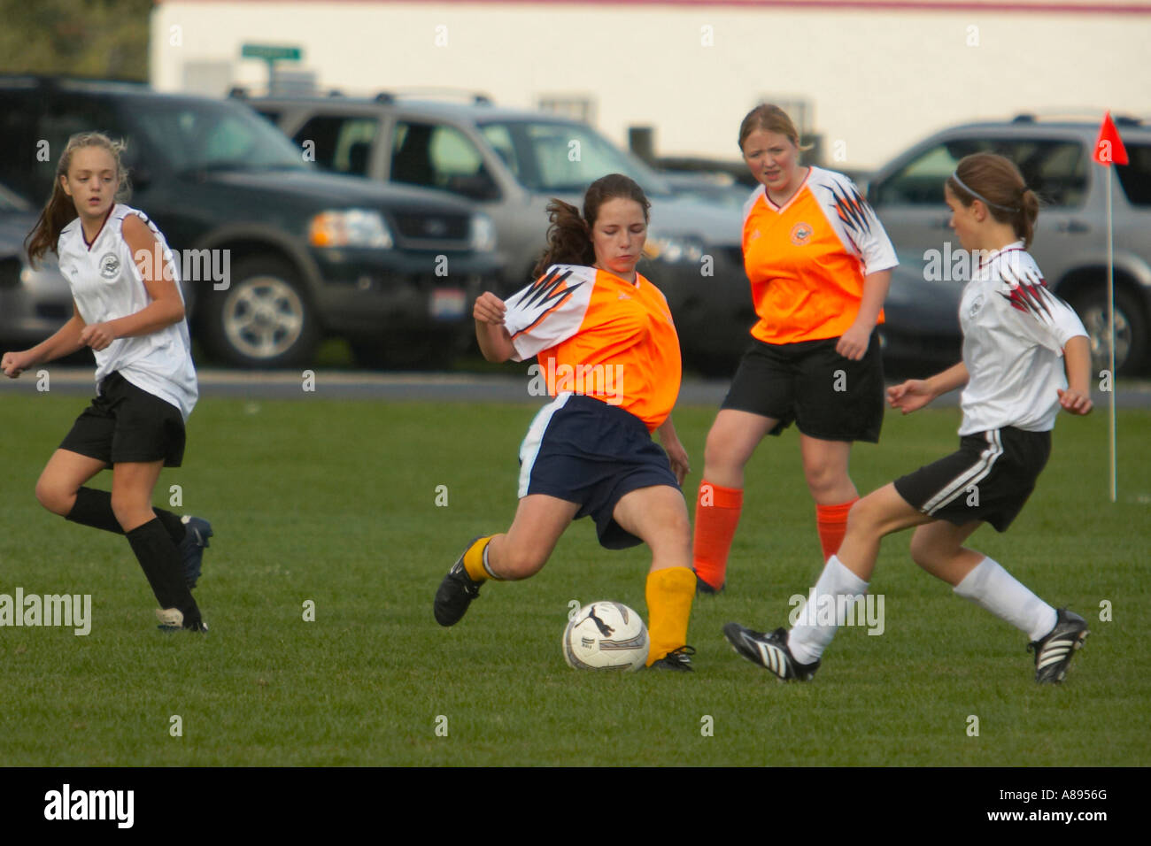 Girls playing soccer during a game Stock Photo - Alamy