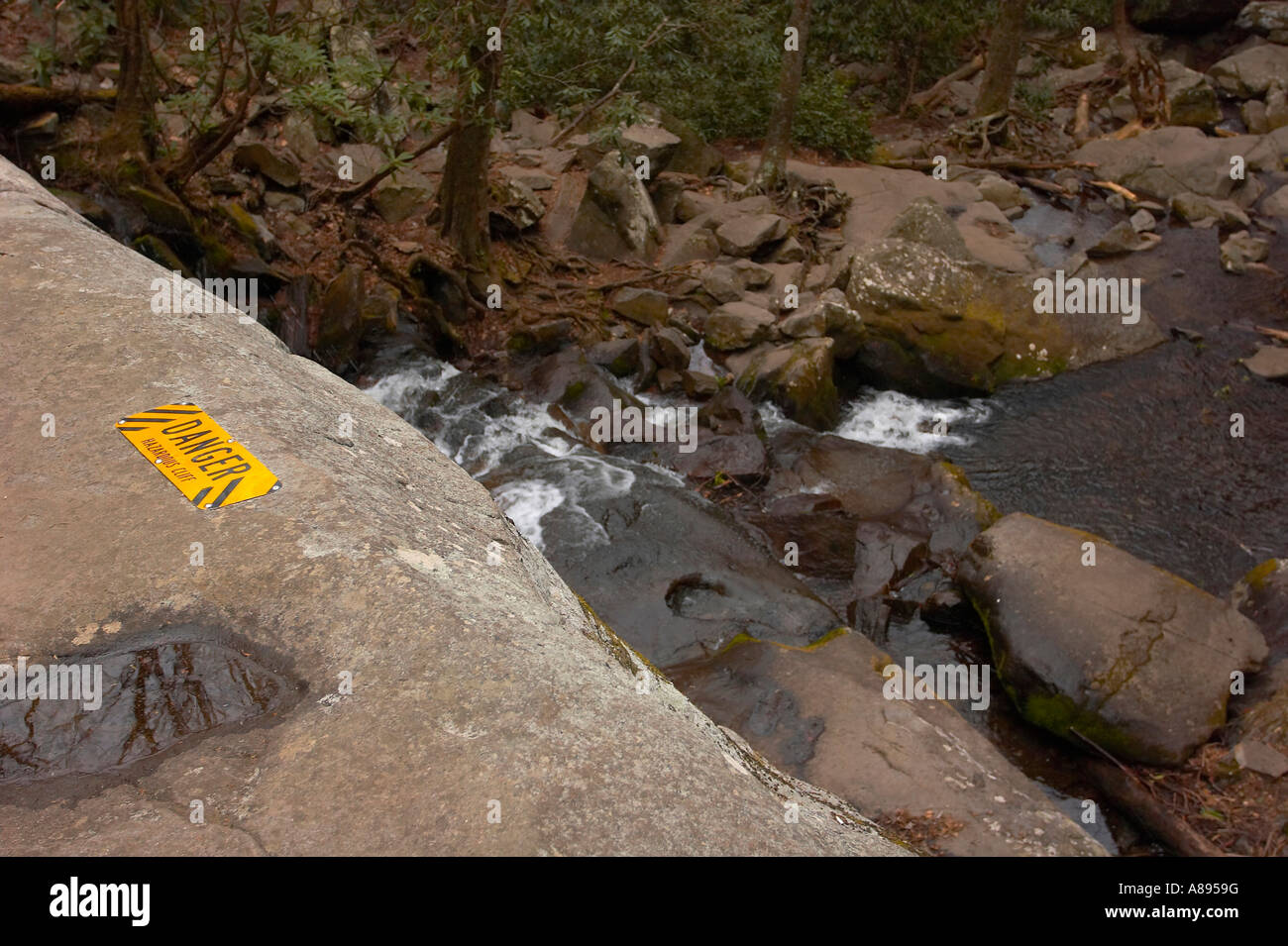 A sign warning of danger hazardous cliff at Laurel Falls in Great Smoky ...