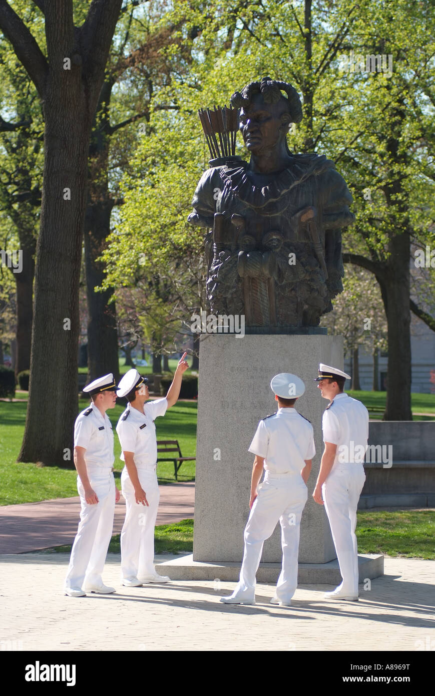 Midshipmen look at the sculpture of Tecumseh on the campus of the U S ...