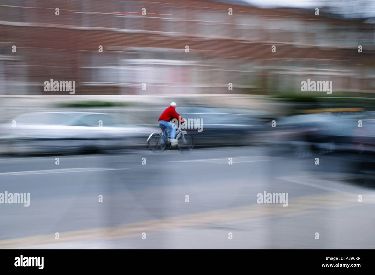 Man on a bike speeding Stock Photo - Alamy