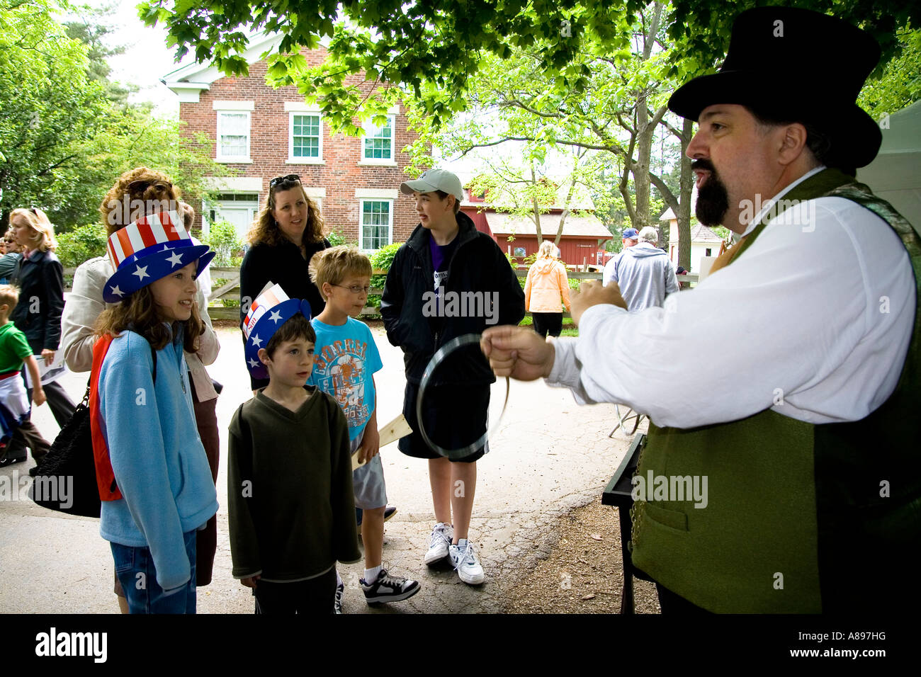 children watching magician Naper Village museum settlement civil war ...