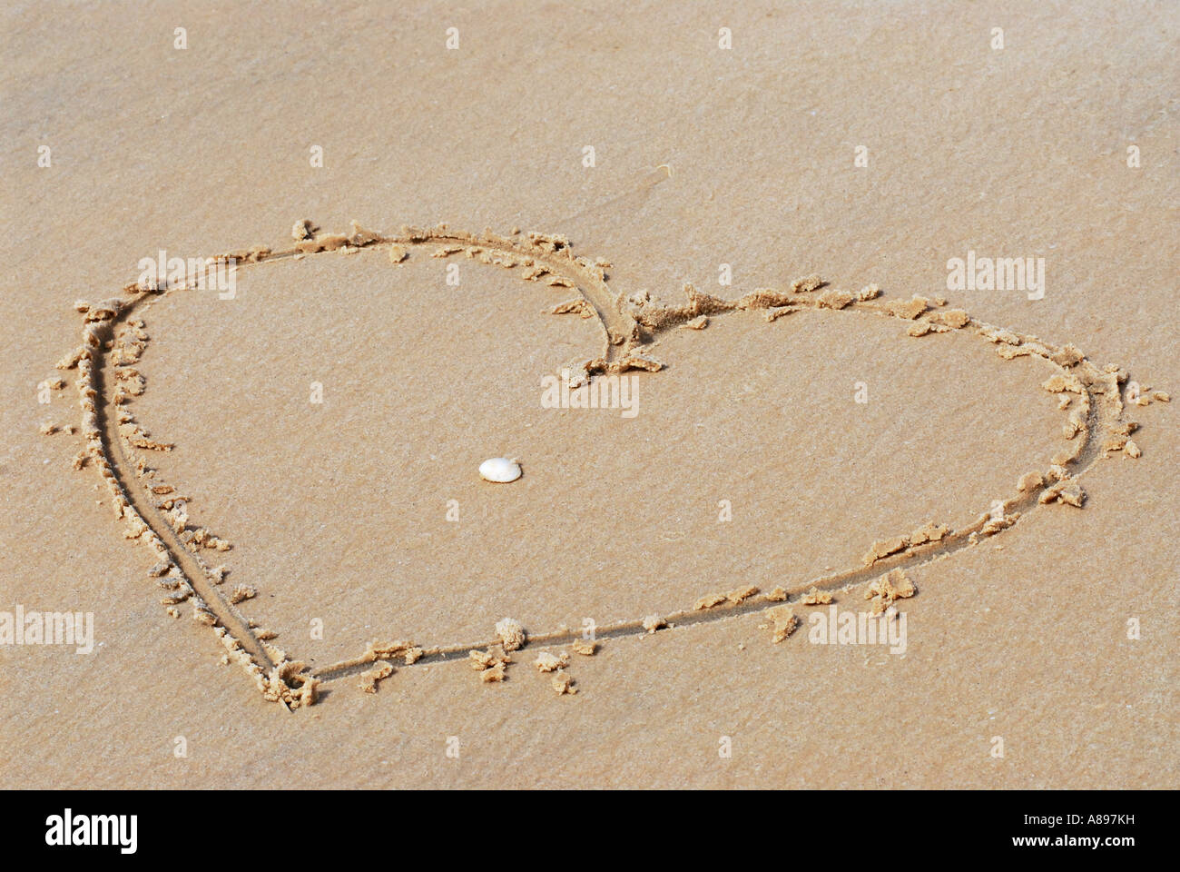 Heart in the sand Stock Photo - Alamy