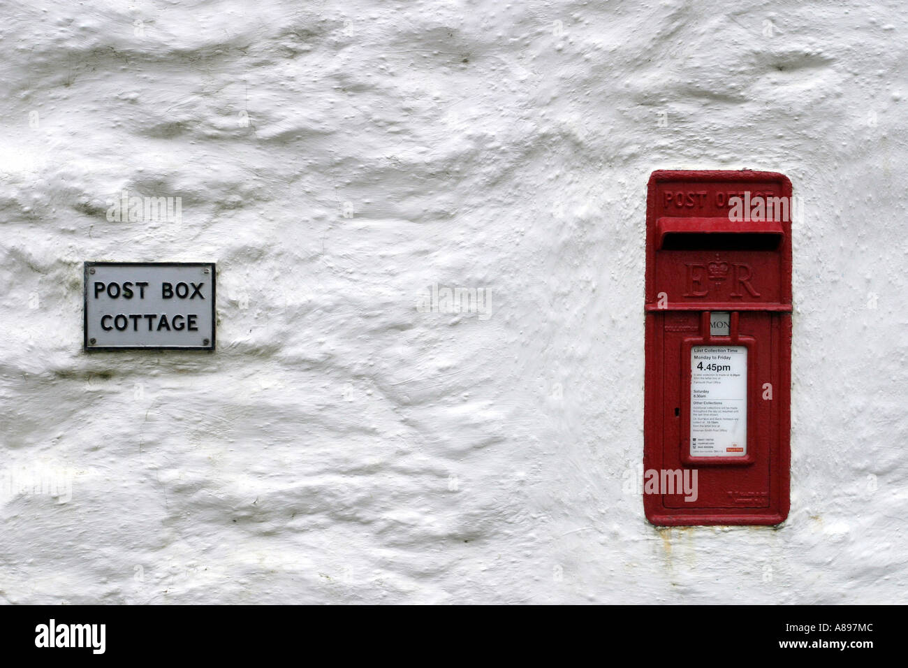 Whitewashed wall of a cottage with traditional mail box. Post Office ...