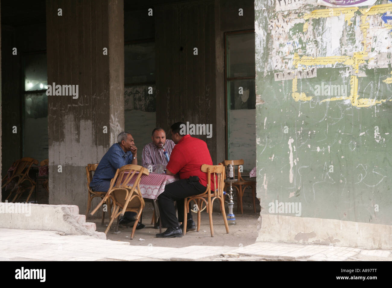 Men sharing hookah outside cafe in Cairo, Egypt, Middle East Stock ...