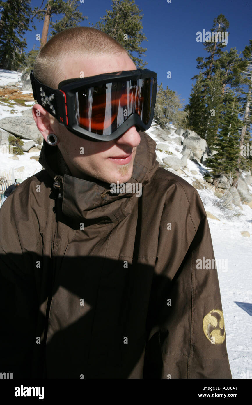 Young man wearing snow goggles Stock Photo - Alamy