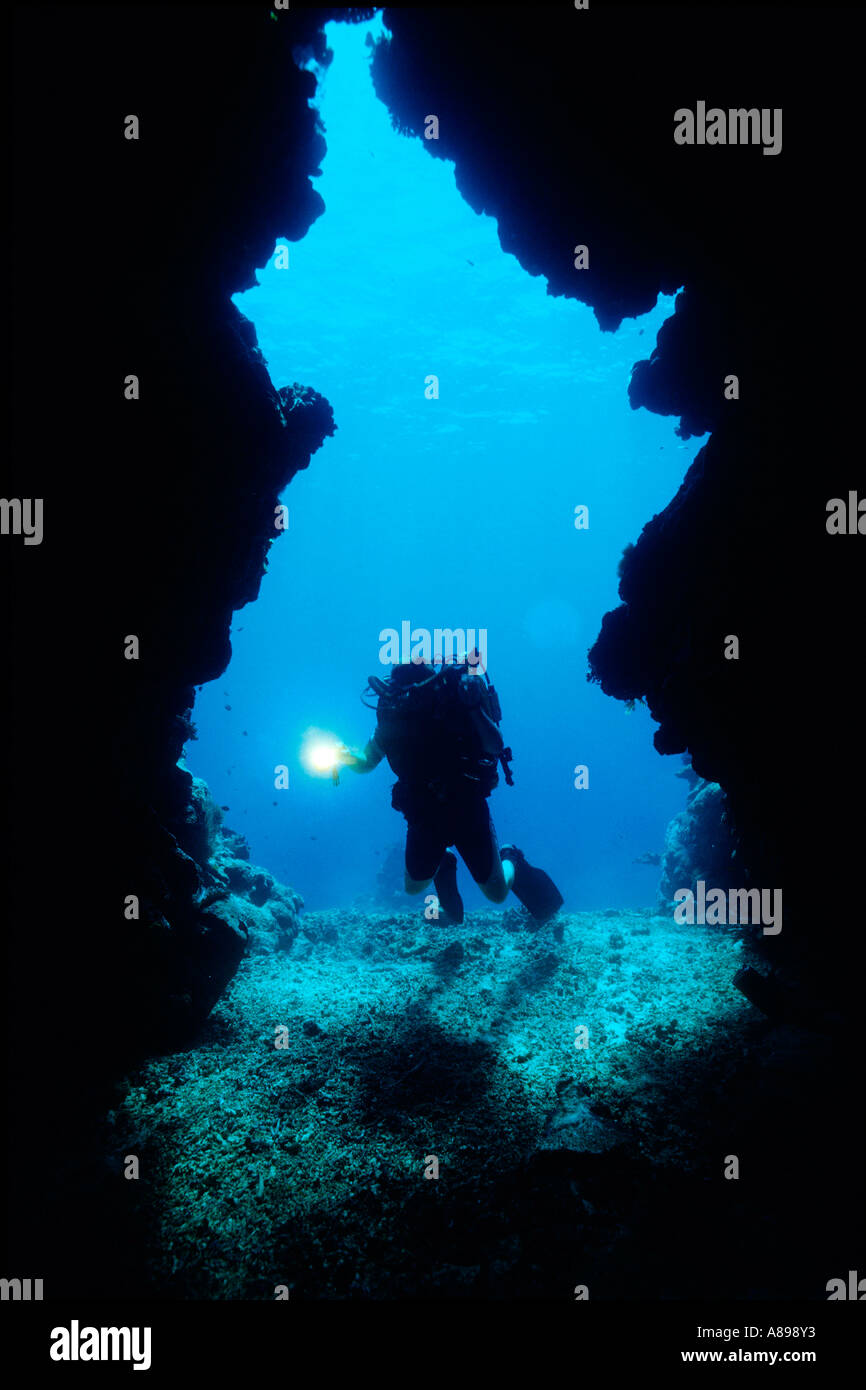 Diver exploring cave Fiji Pacific Ocean Stock Photo - Alamy