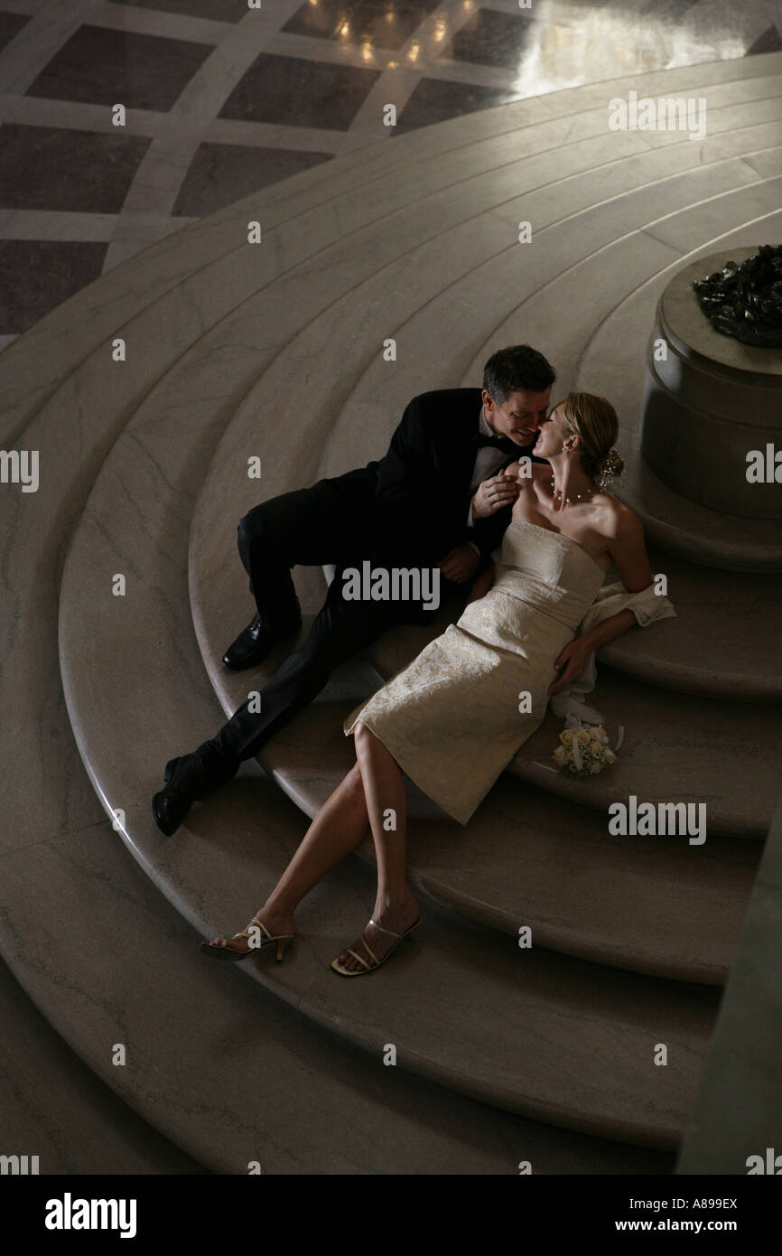 Couple kissing on staircase hi-res stock photography and images - Alamy