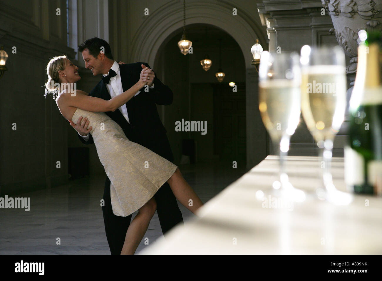 Man dipping woman Stock Photo - Alamy