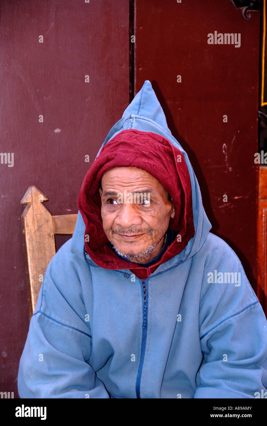 Man dressed in traditional garment with pointed hood medina Marrakech ...