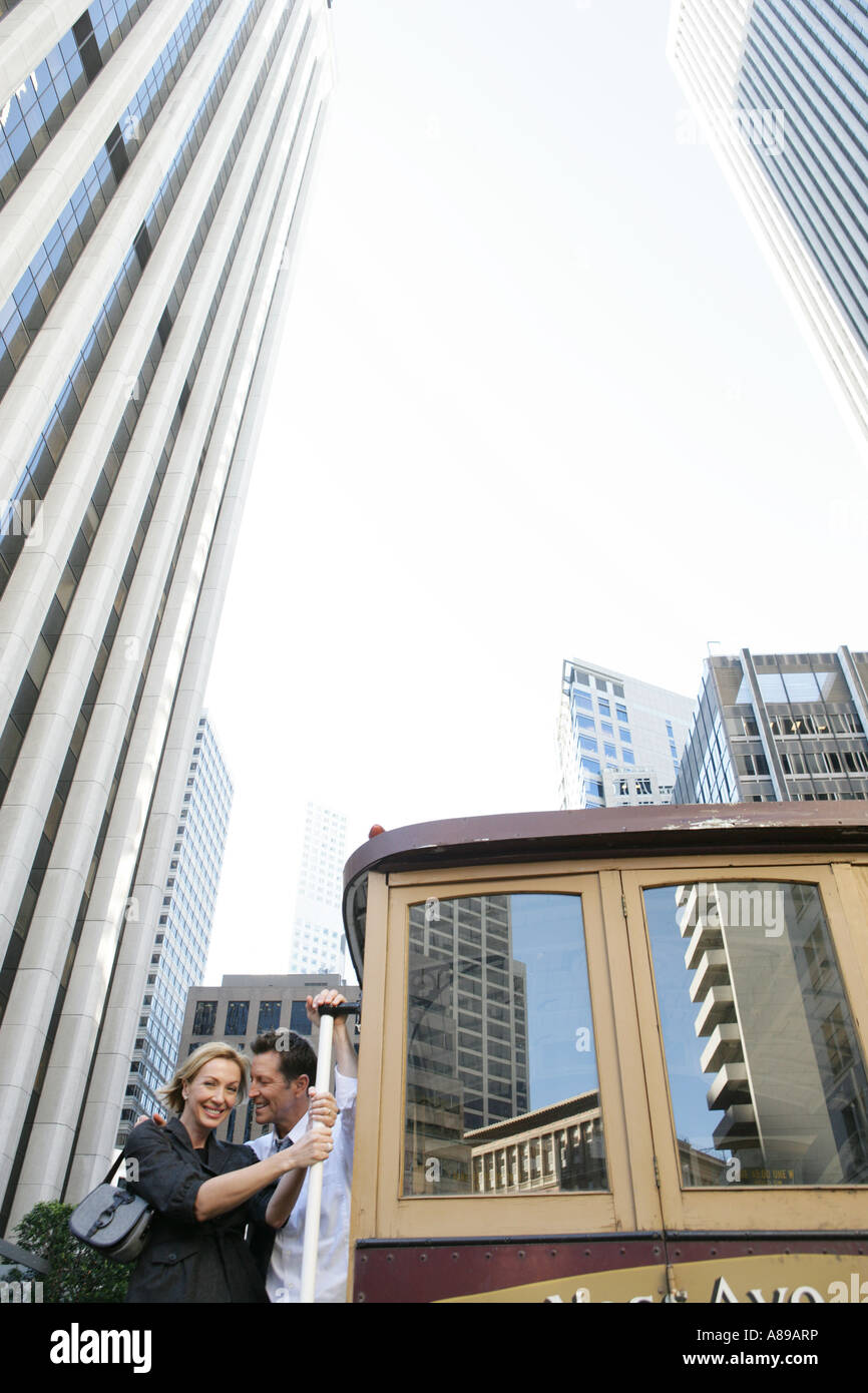 Couple riding a trolley car Stock Photo - Alamy