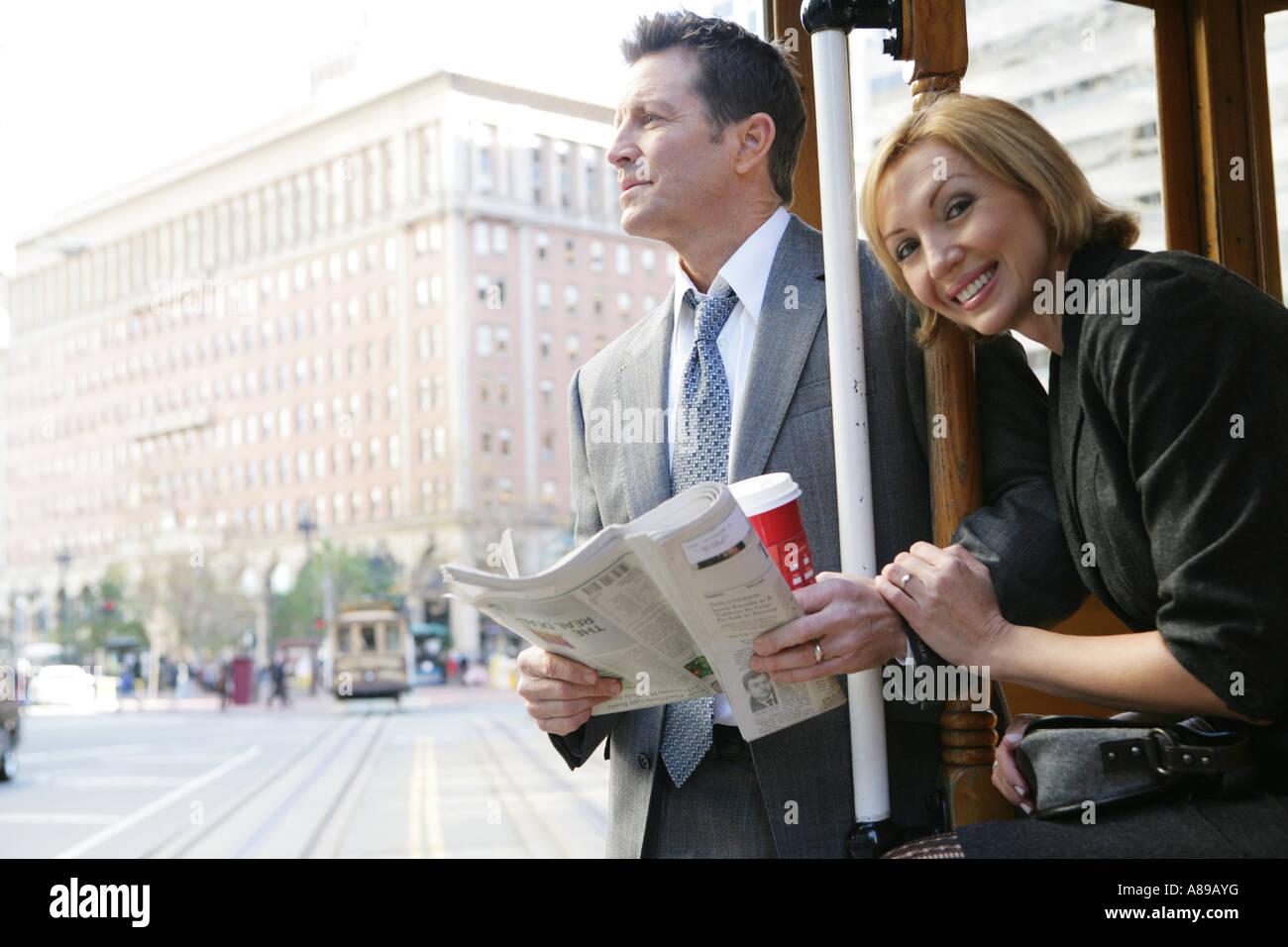 Couple riding a trolley car Stock Photo - Alamy