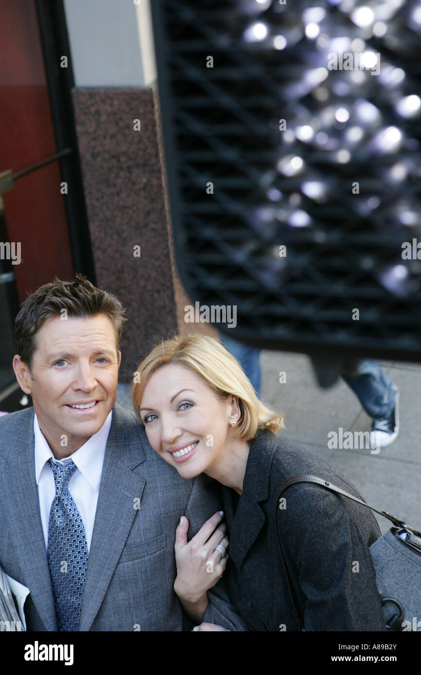 Couple underneath a pedestrian crossing sign Stock Photo - Alamy