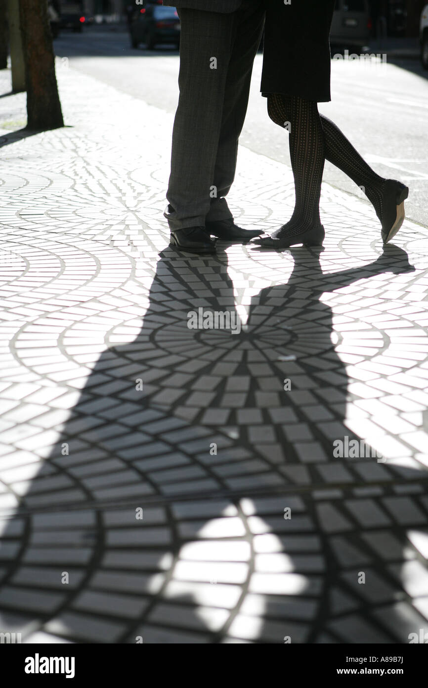 Shadow of two people on the street Stock Photo - Alamy