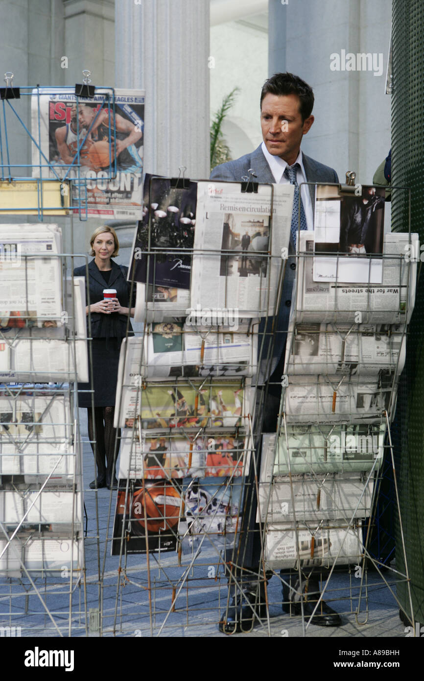 Man looking at a magazine rack Stock Photo - Alamy