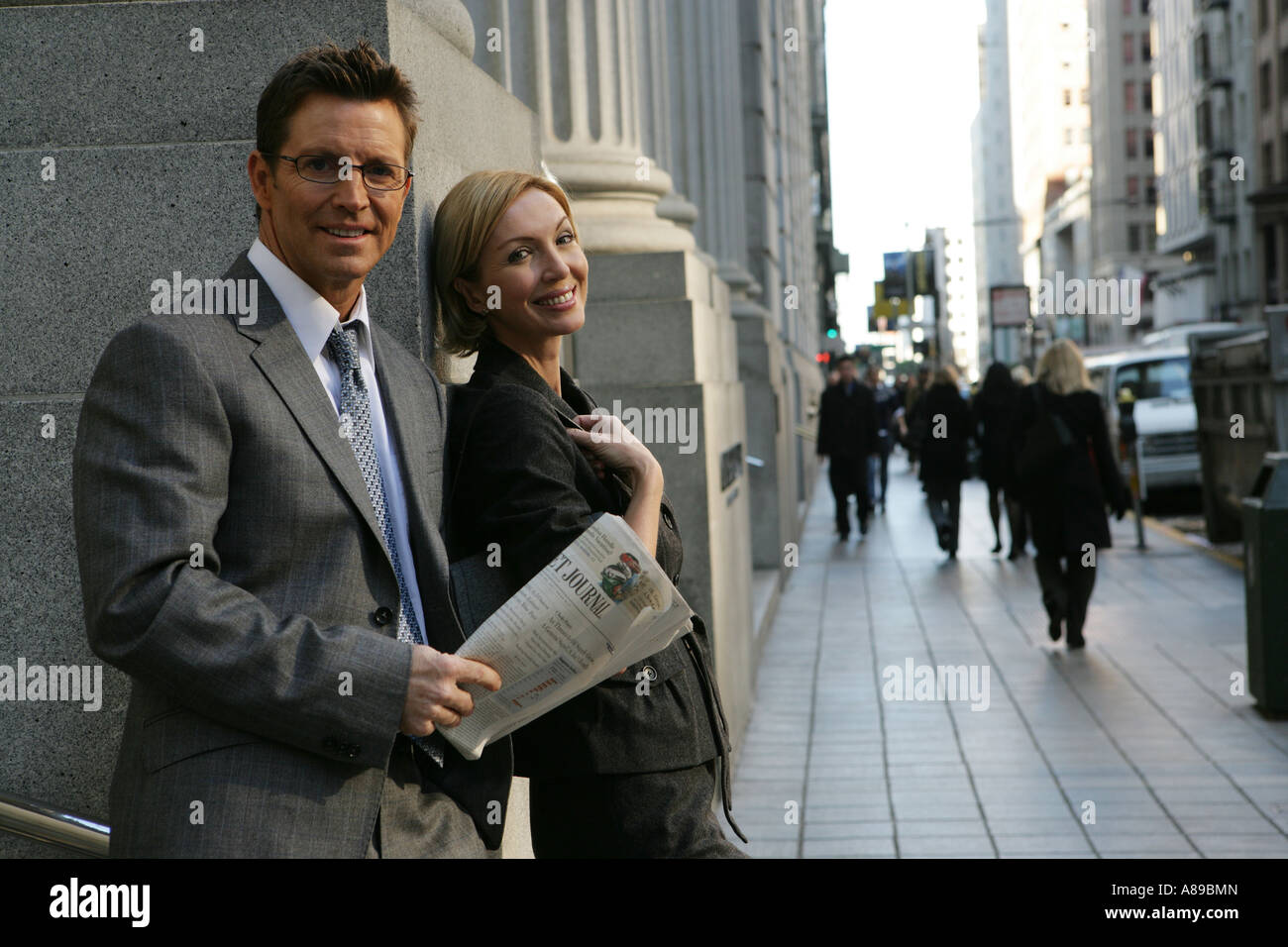 Two people outside looking at camera Stock Photo - Alamy