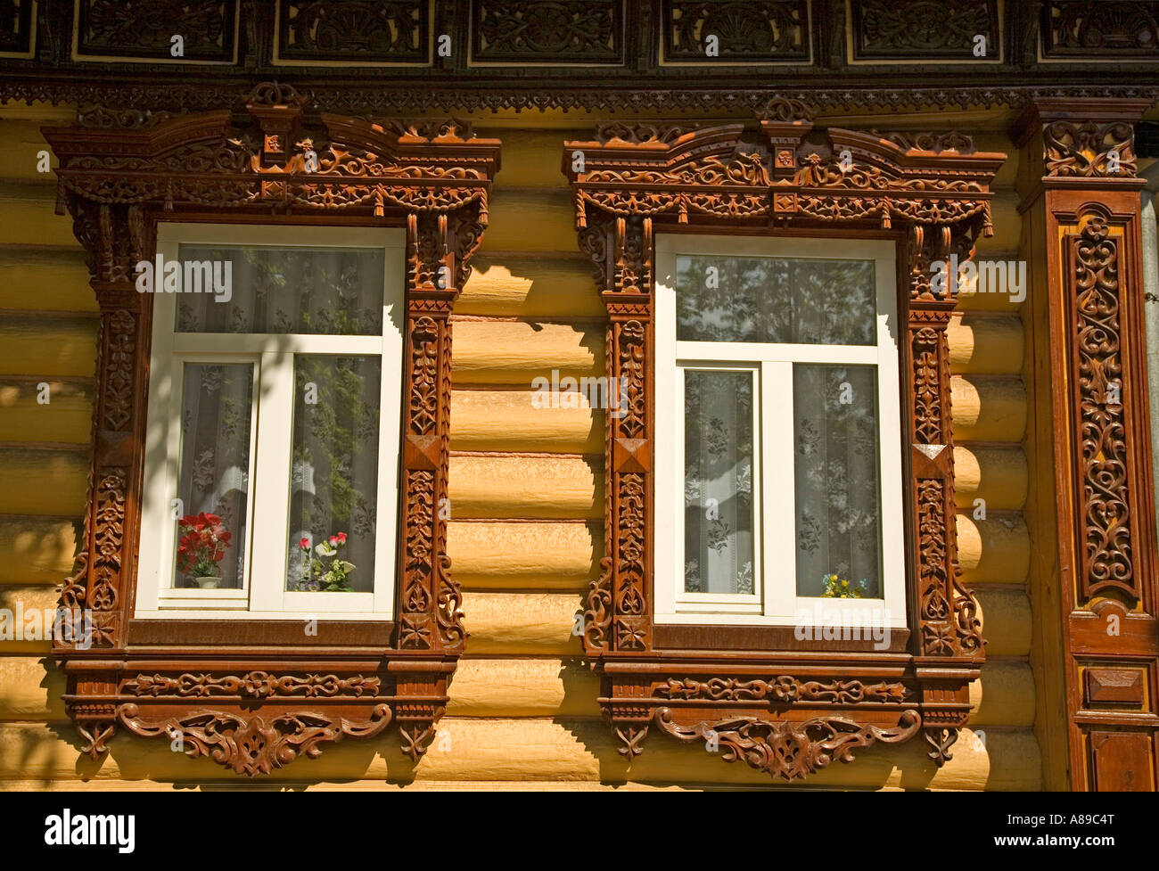Decorated window frame of a timber building, Russia Stock Photo - Alamy