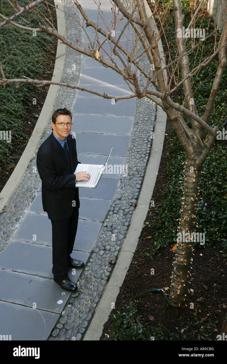 Business man standing on a path Stock Photo - Alamy