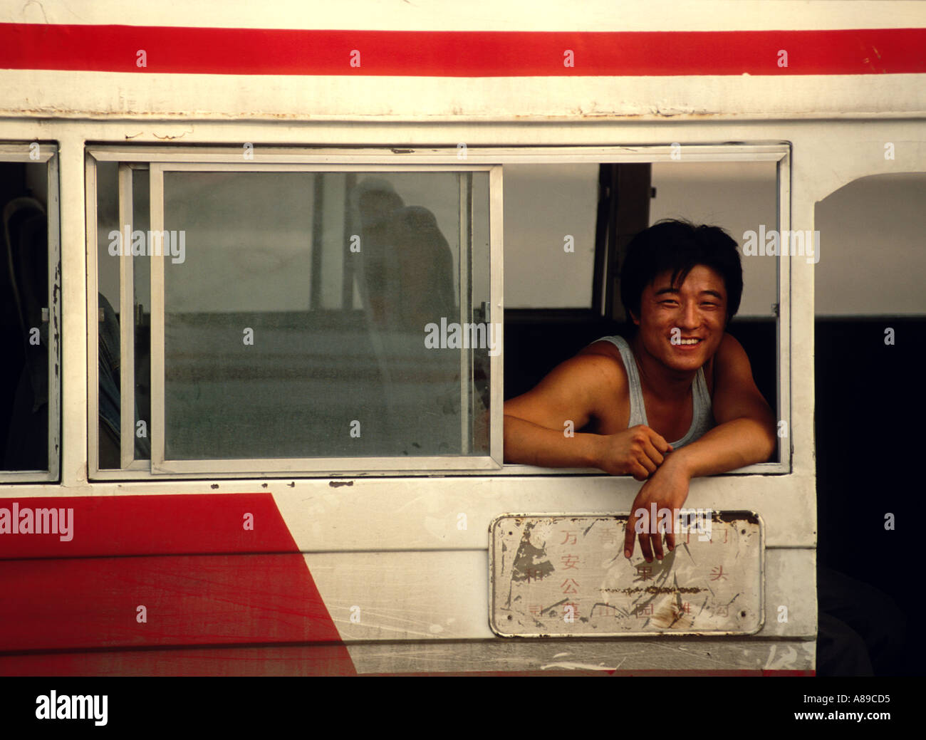 Man hanging bus hi-res stock photography and images - Alamy